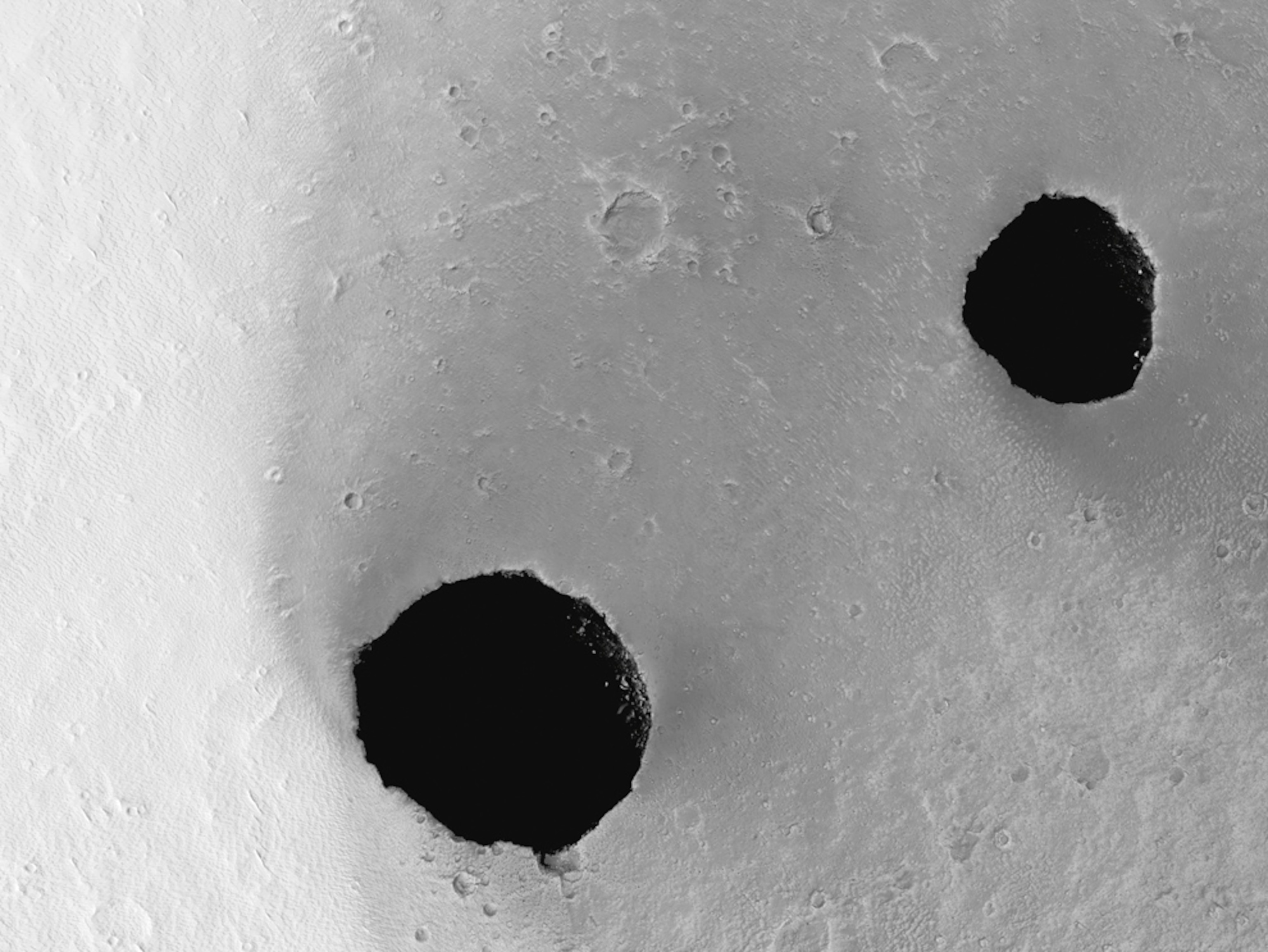 Pictures: Giant Mars Pits Revealed in Sharp Detail