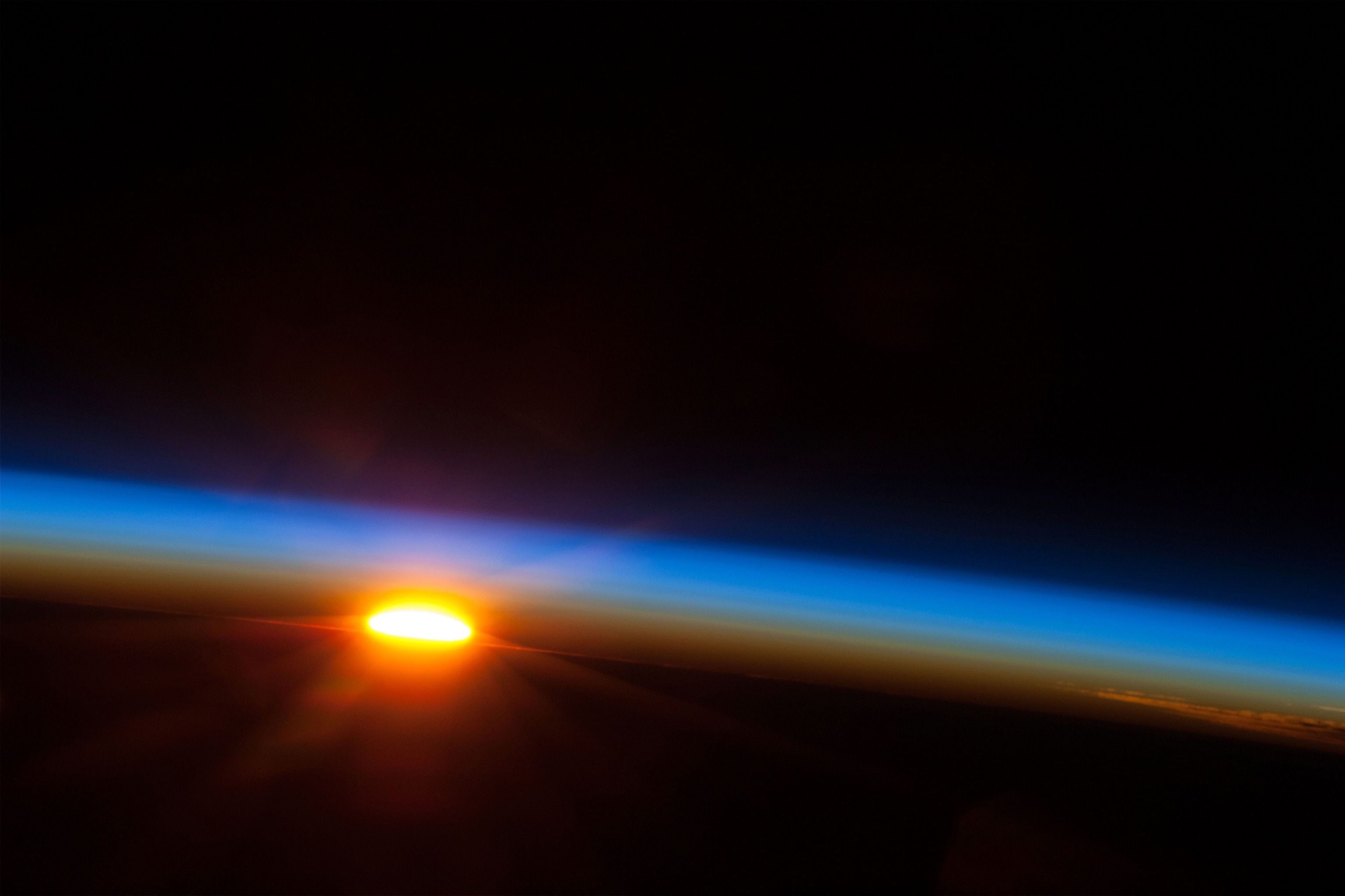 Space Pictures This Week: Sunrise From Space, Saturn After Dark