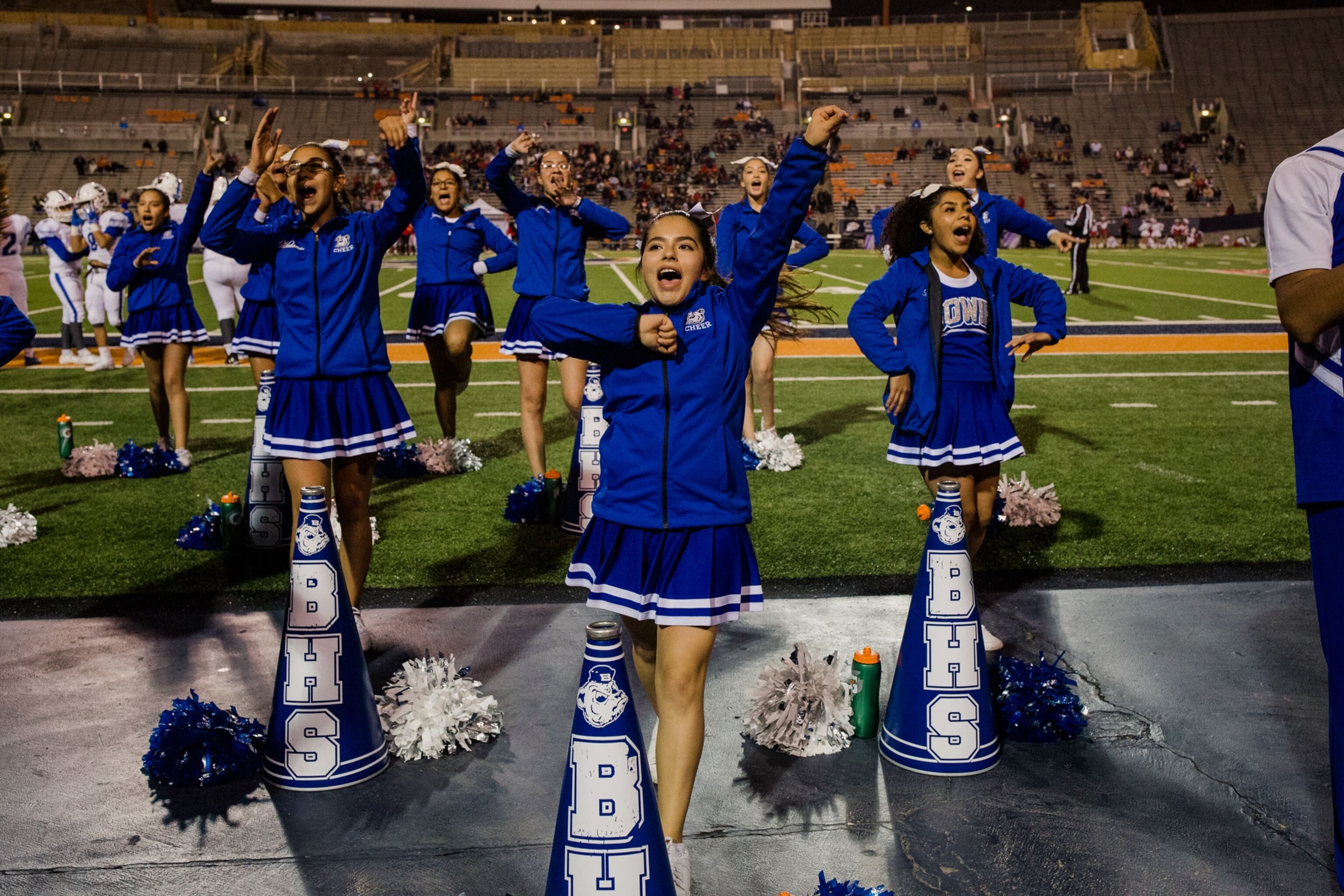 This high school cheer squad is caught between two worlds—divided by a ...
