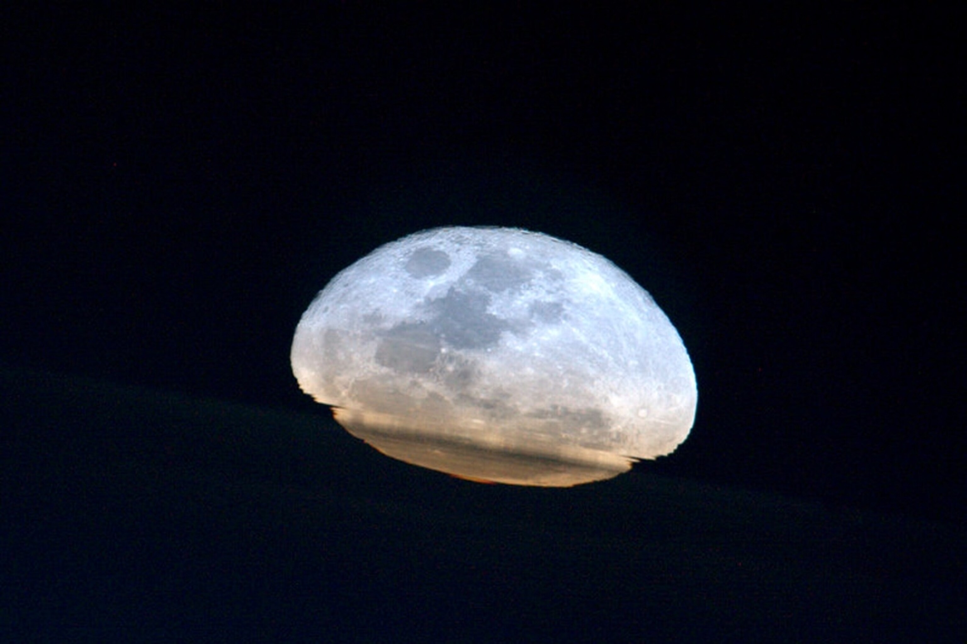 Space Photos This Week: Black Holes, Bent Moon, More