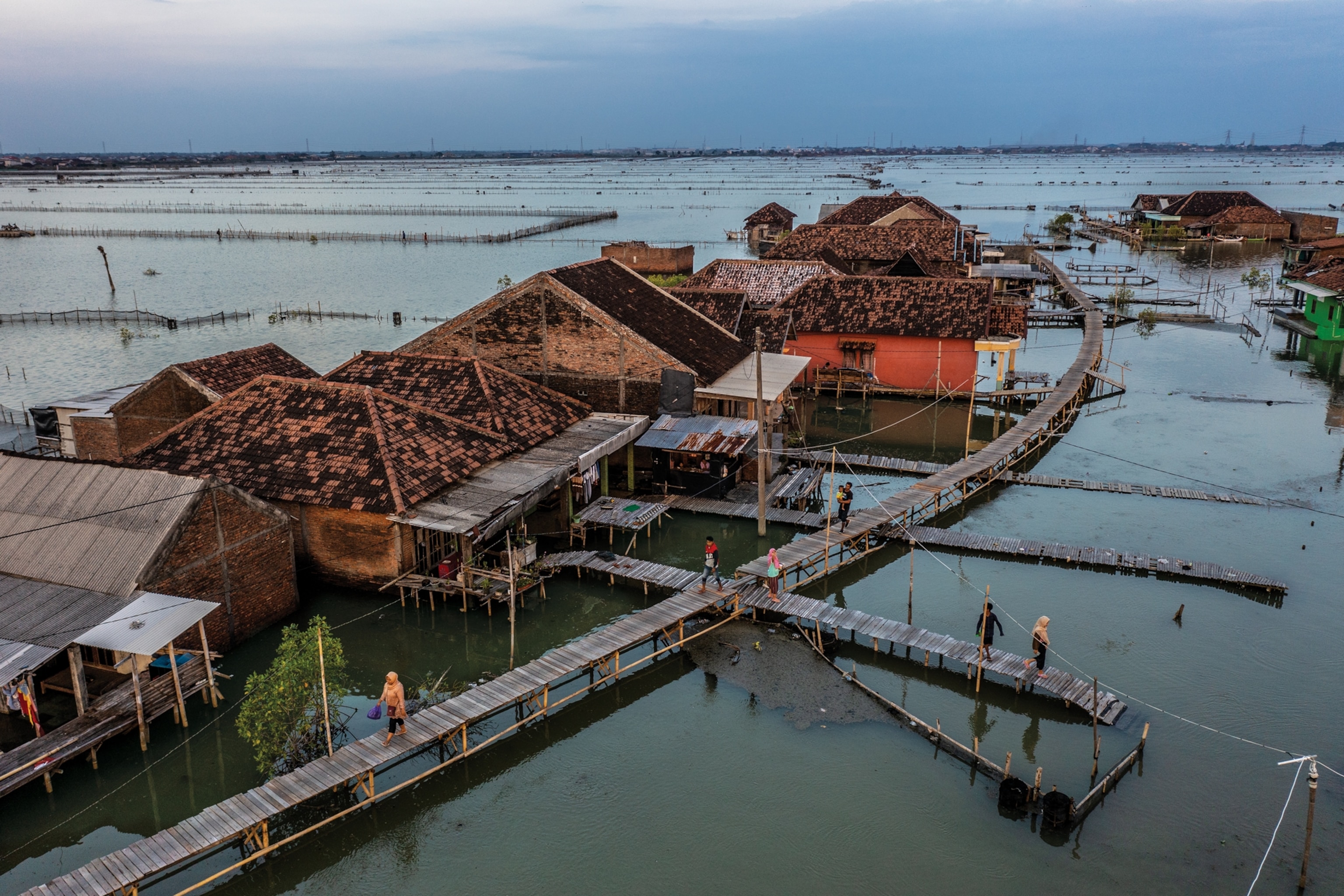 Their homes are sinking fast. Can their community survive?