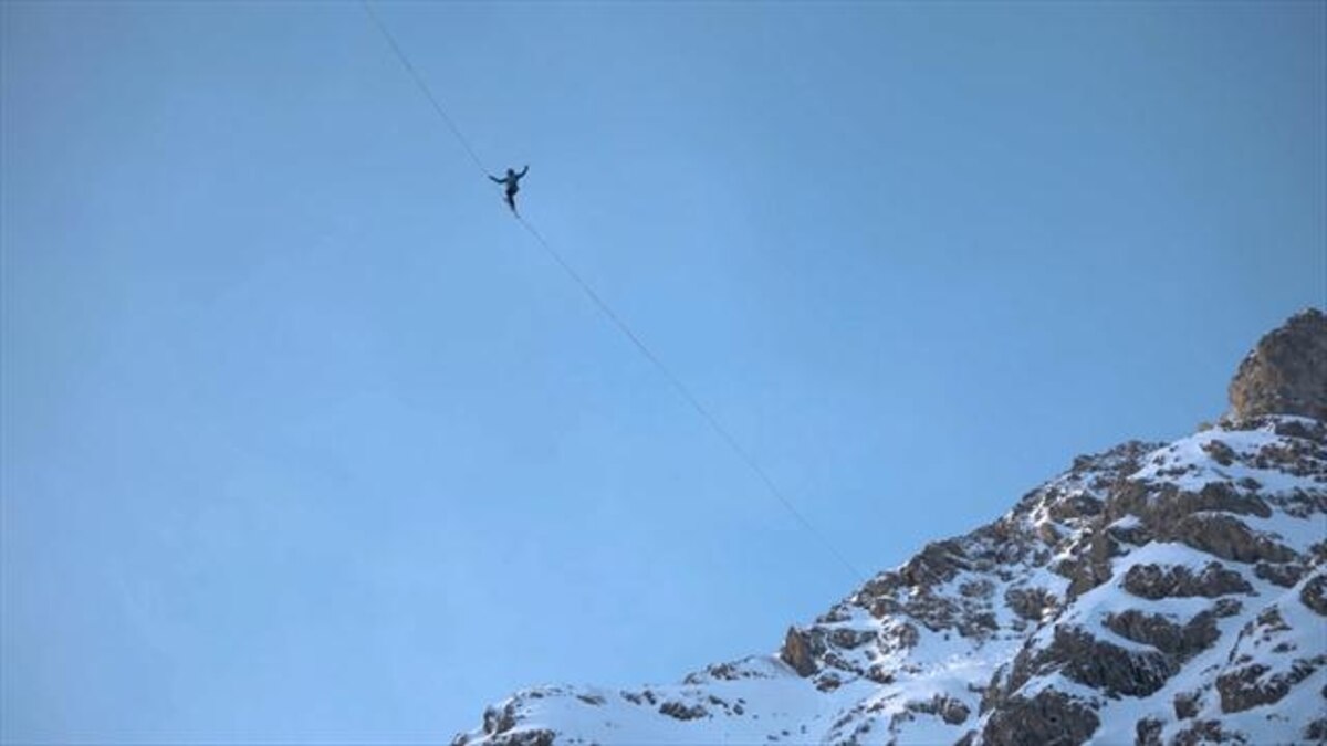 Two Men Do Gymnastics on a Slackline in the Icy Alps | National Geographic