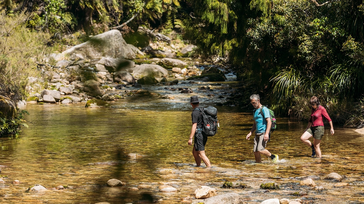 Coastal dips and river wading on a multi-day hike through New Zealand's ...