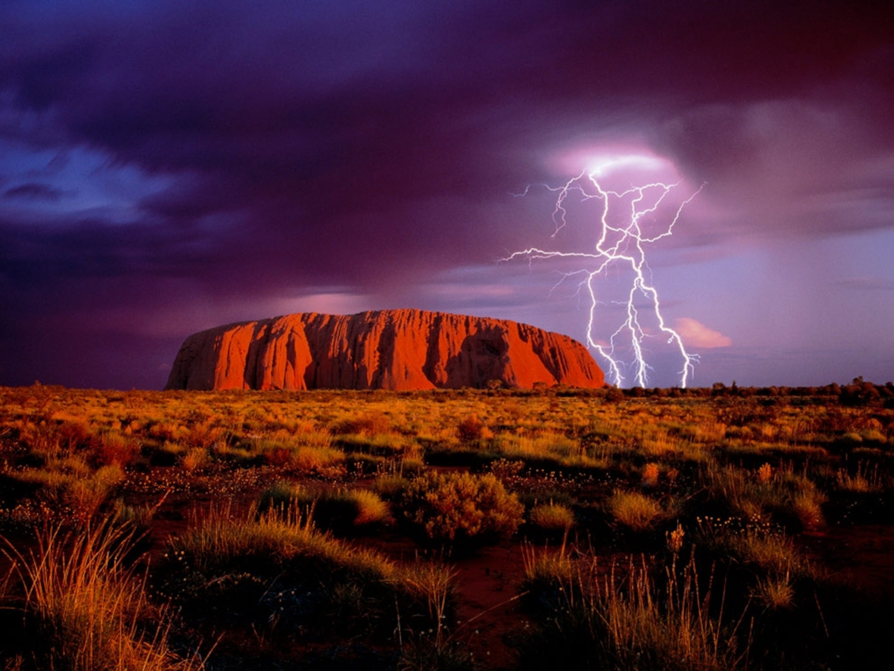 Dazzling Light Display Illuminates Australia's Iconic Rock
