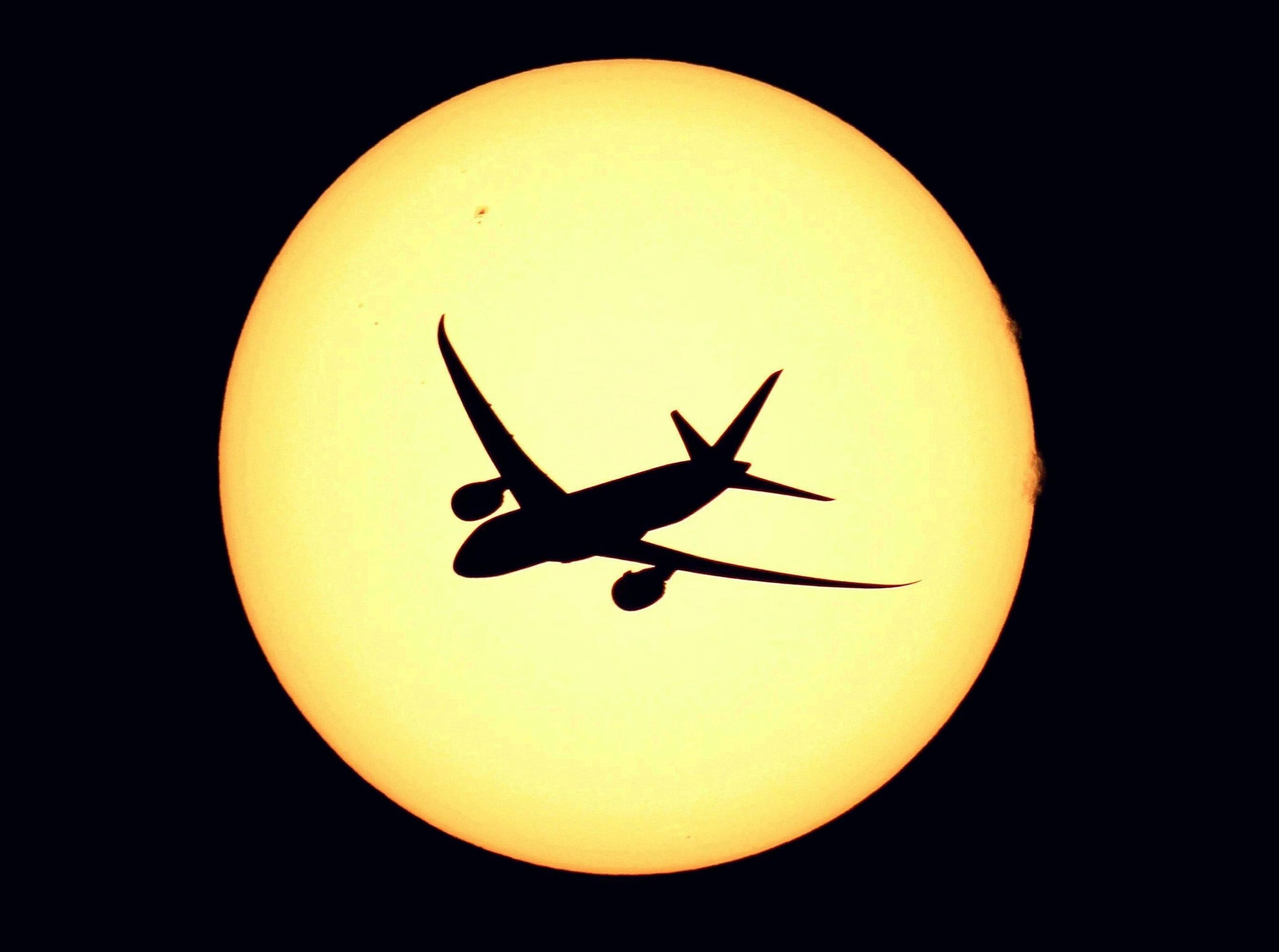 Dreamlike Photos of Planes Flying Past the Sun and Moon | National ...